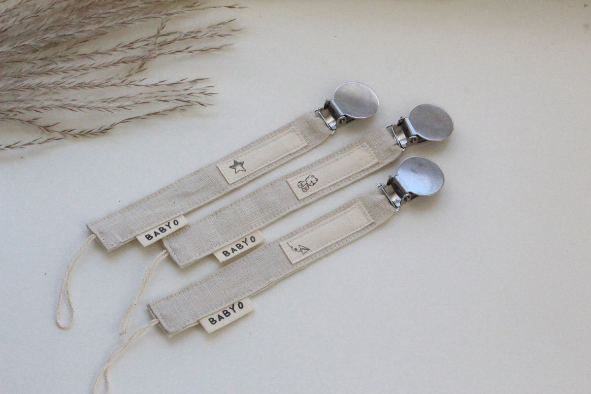 Babyo Linen Pacifier Clip Paper Plane Label - Tan – Moonlight